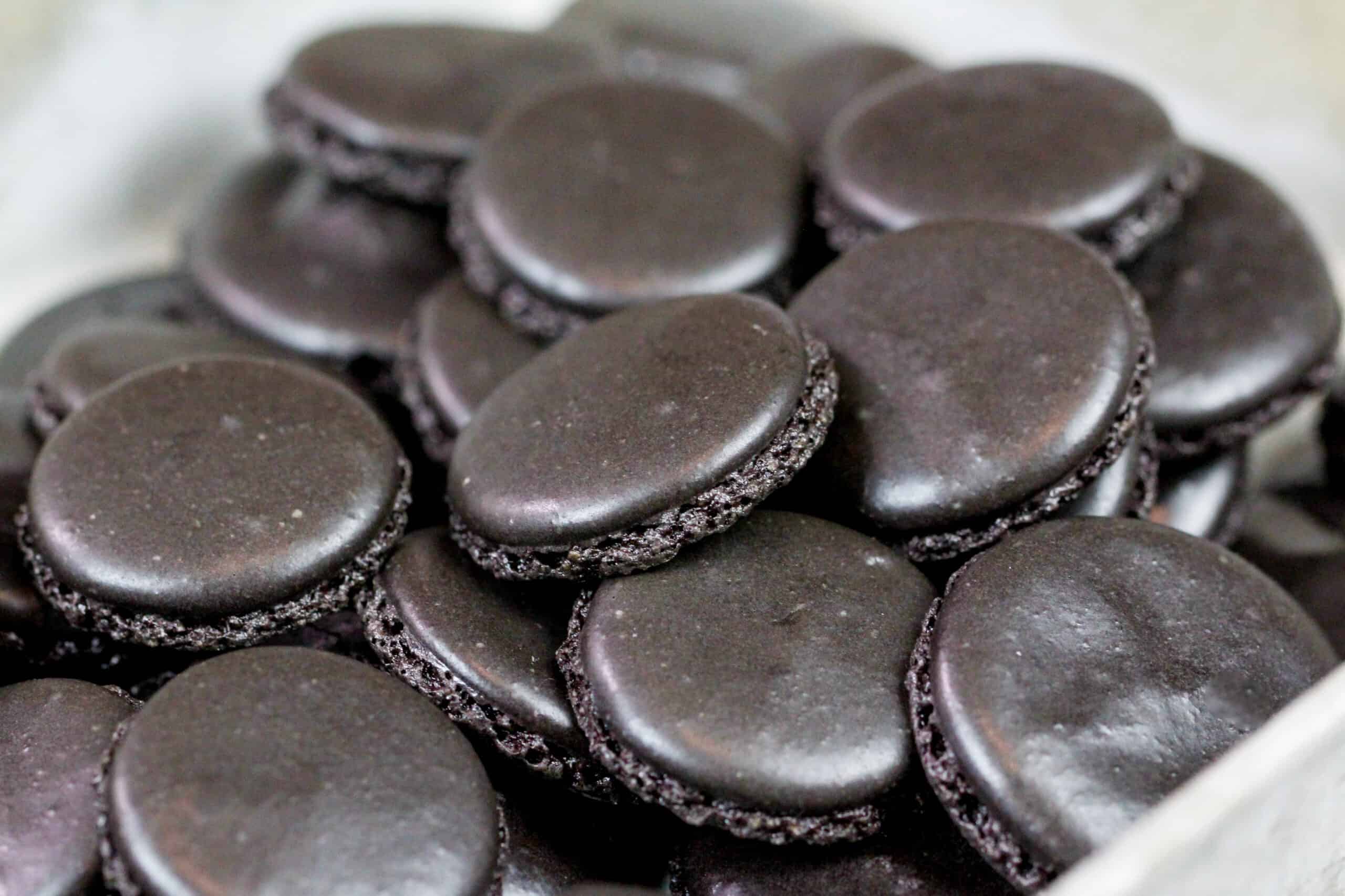 Black Macarons with Decadent Dark Chocolate Filling - Chelsweets
